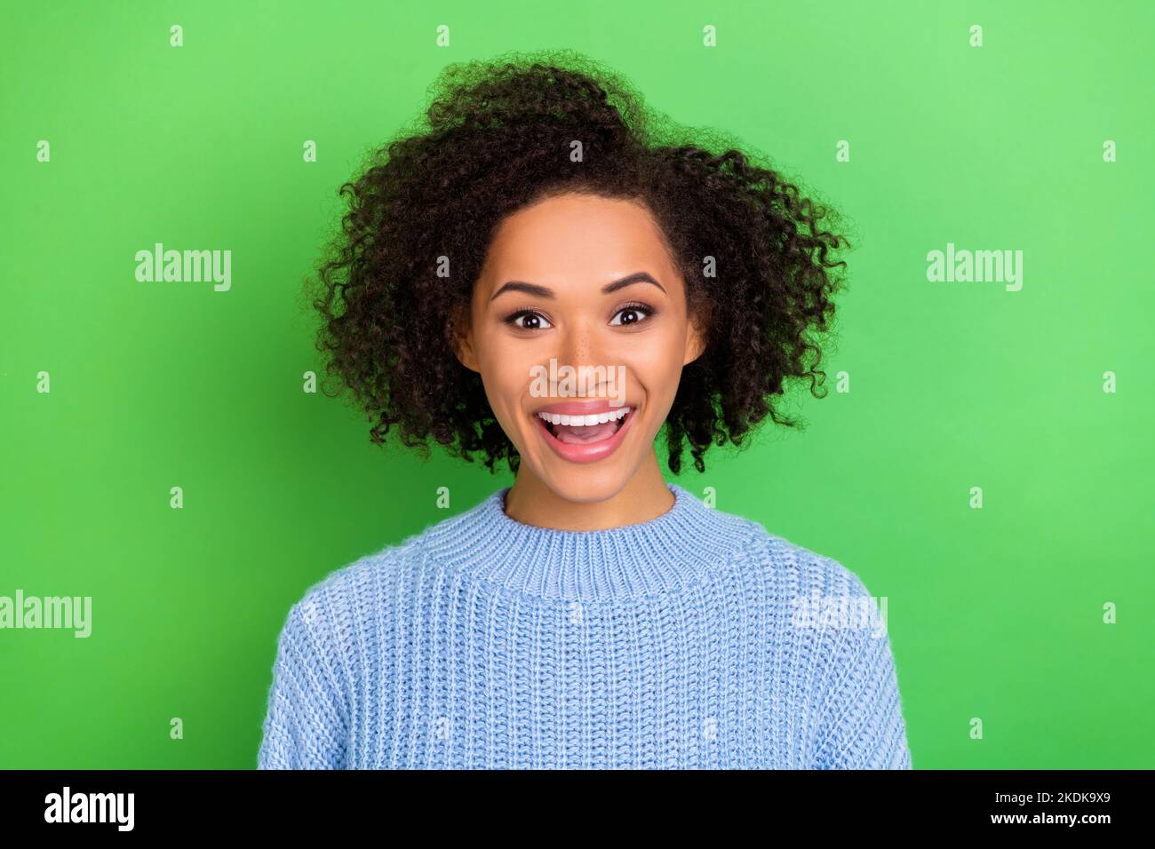 Photo of cheerful toothy beaming girl with wavy hairstyle dressed blue ...