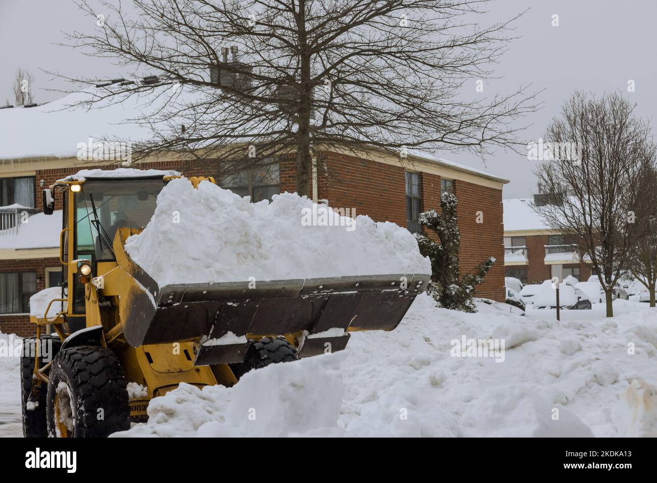 Winter time cleanup of snow following huge snowstorm with tractor after ...