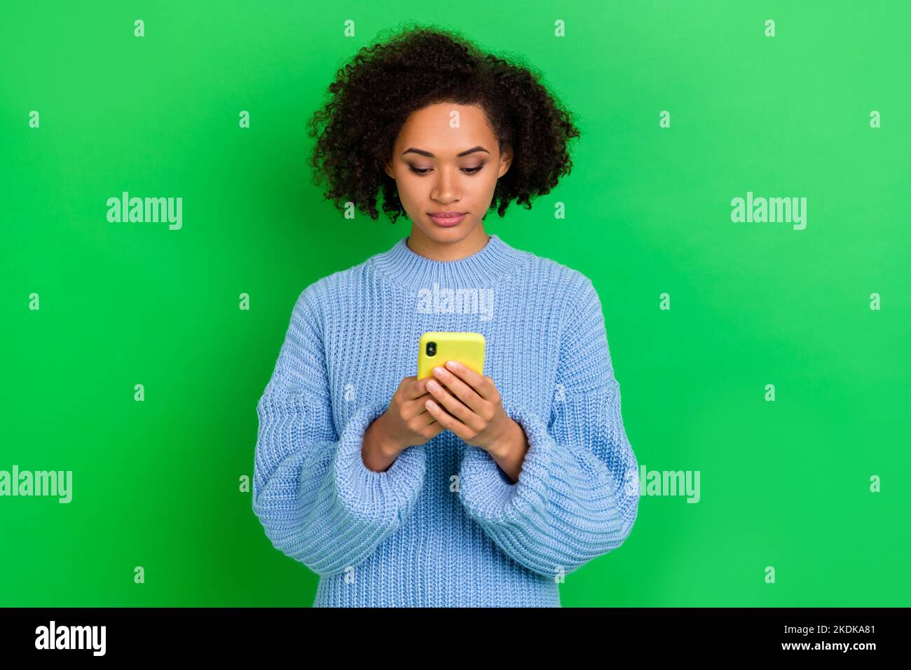 Photo of cute curly brunette lady look telephone wear blue pullover ...