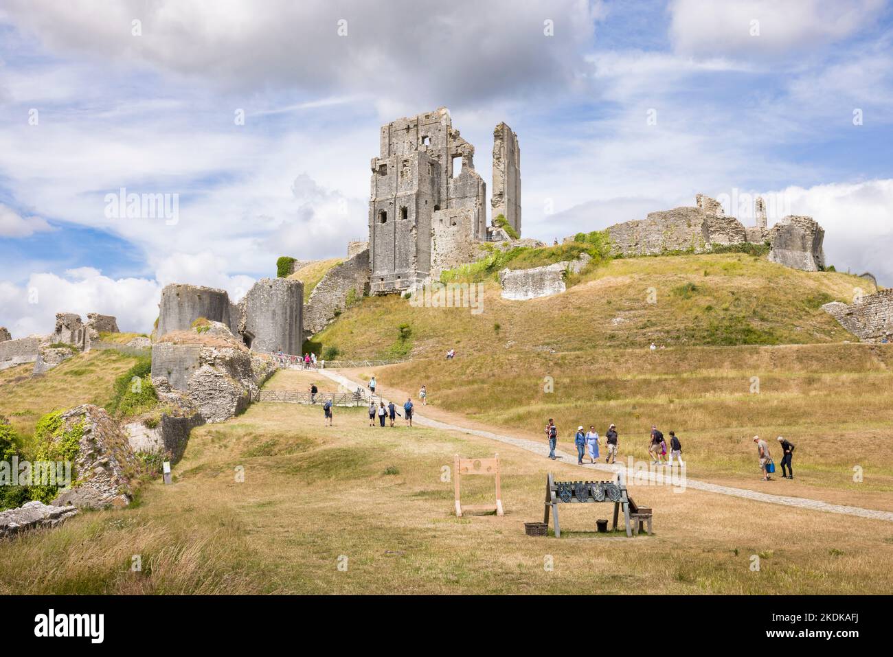 DORSET, UK - July 06, 2022. Tourists visiting Corfe Castle ruins during ...