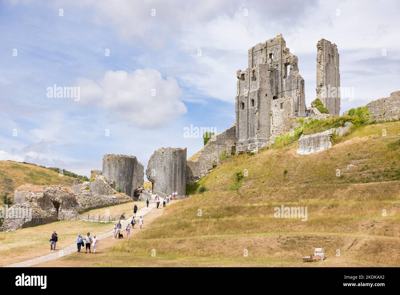DORSET, UK - July 06, 2022. Tourists visiting Corfe Castle ruins during ...