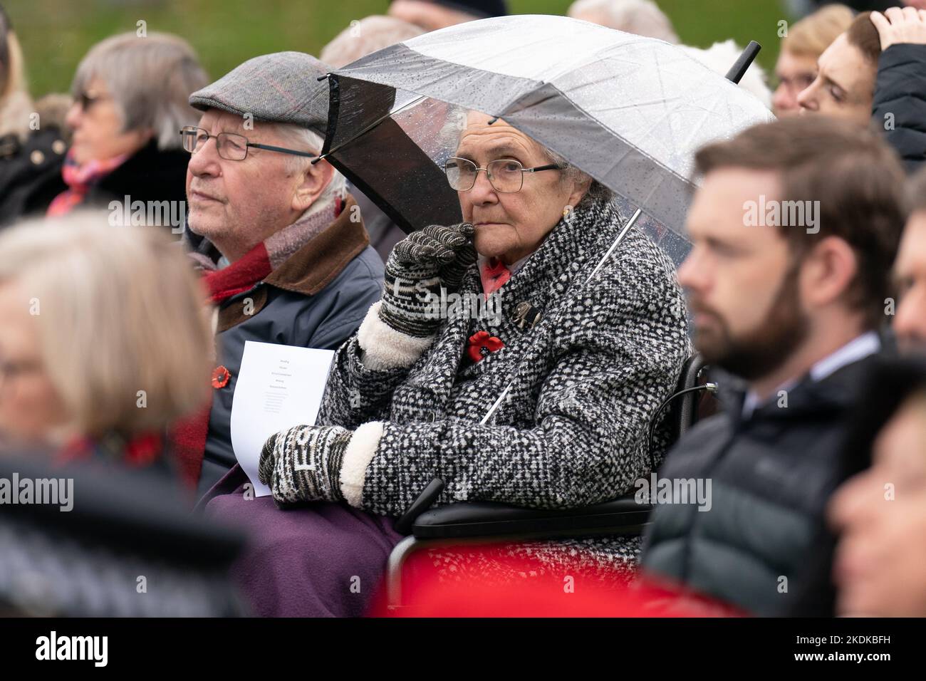 Guests shelter from the rain as they attend the official opening of the ...