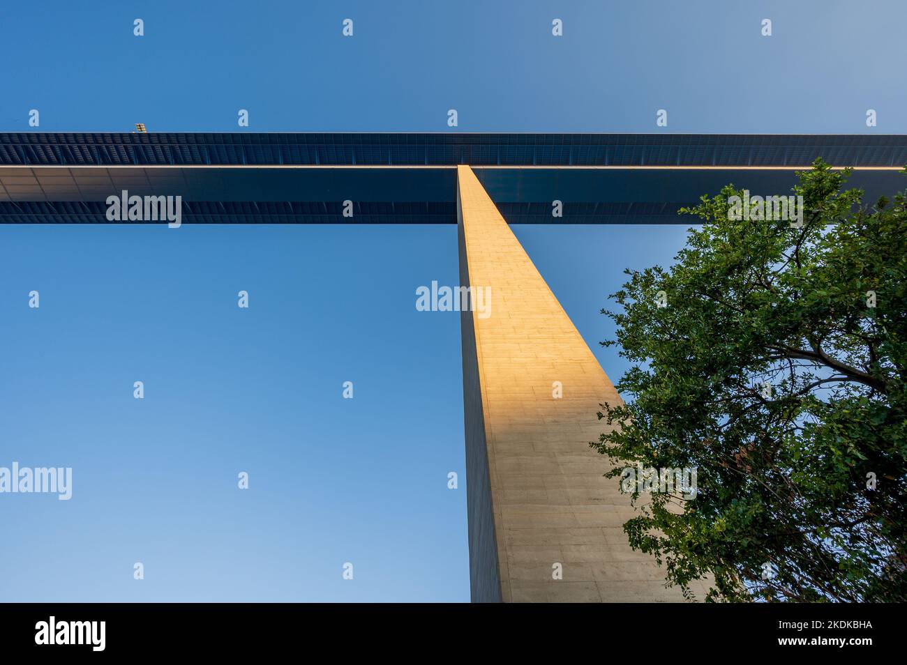 View up a pillar of the 136m tall Moseltal bridge at sunrise with tree ...