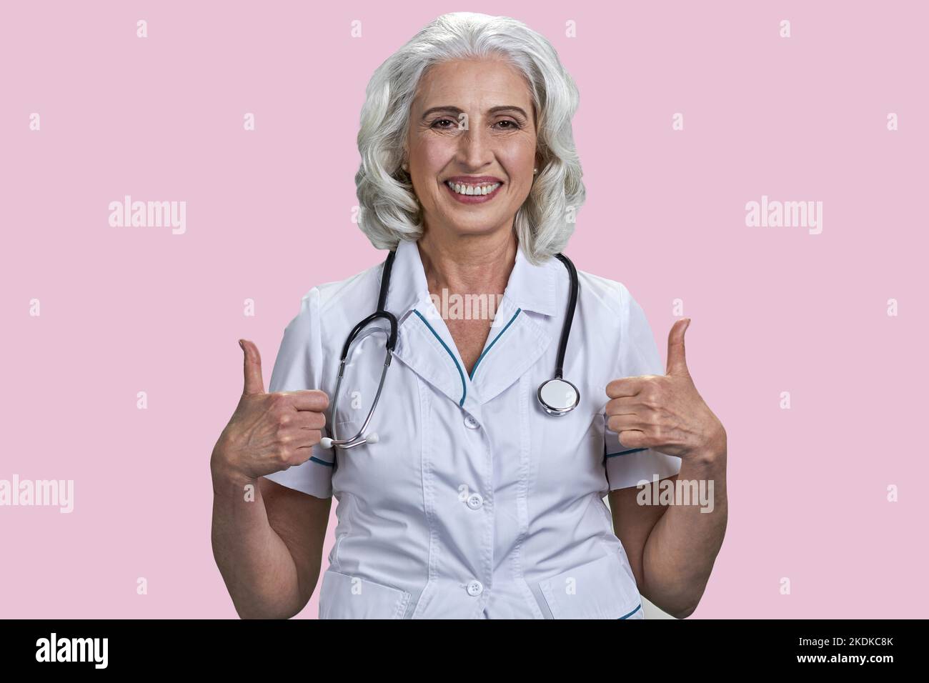 Portrait of smiling cheerful female doctor with stethoscope. Isolated ...