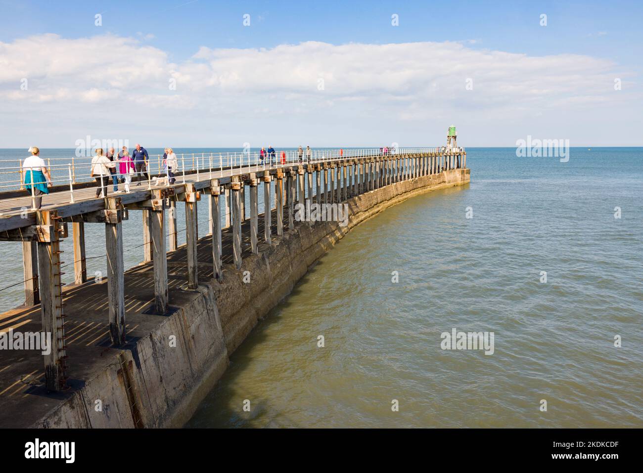 WHITBY, UK - September 21, 2022. Tourists walking on Whitby Pier ...