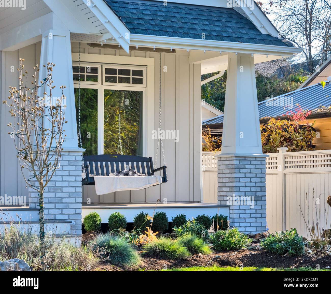 Luxury family house with swinging bench on the open patio Stock Photo ...