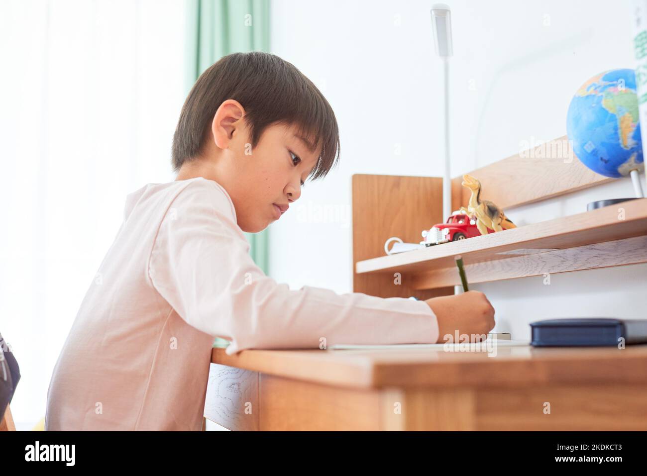 Japanese kid studying at home Stock Photo - Alamy