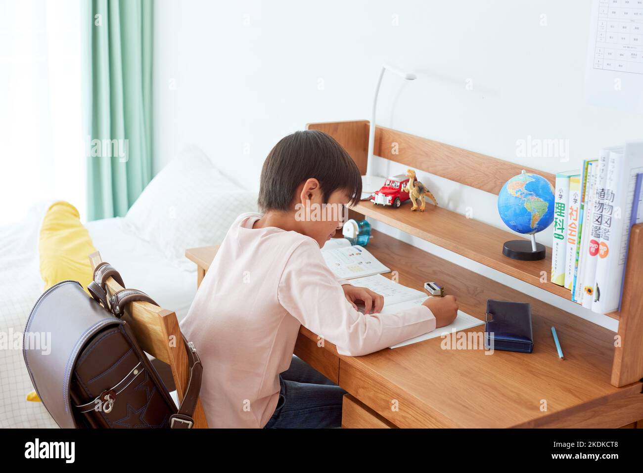 Japanese kid studying at home Stock Photo - Alamy