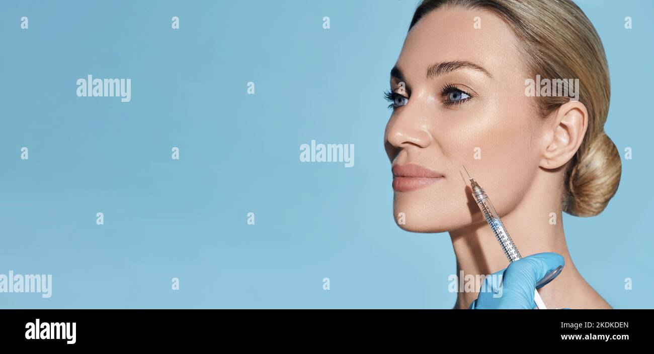 Beautician Doing Beauty Injection Into Nasolabial Folds On Woman Face