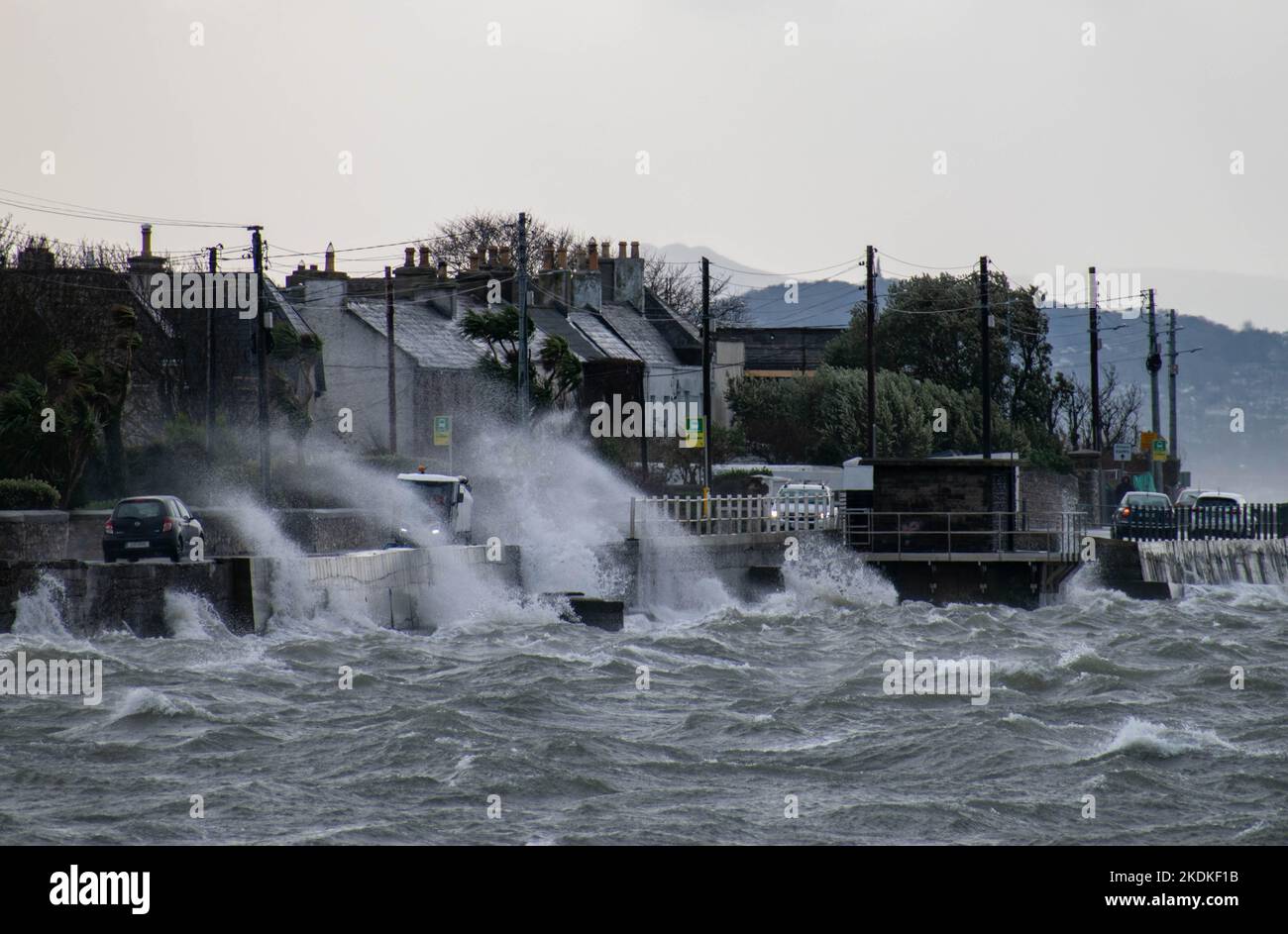 Waves overtopping the wall at Sutton Strand during Storm Eunice Stock ...