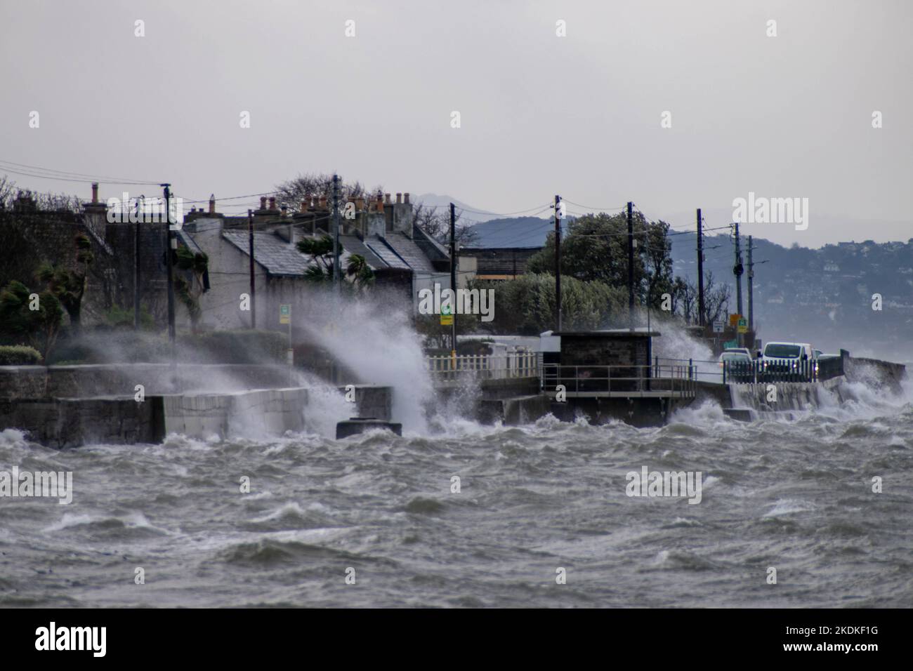 Waves overtopping the wall at Sutton Strand during Storm Eunice Stock ...