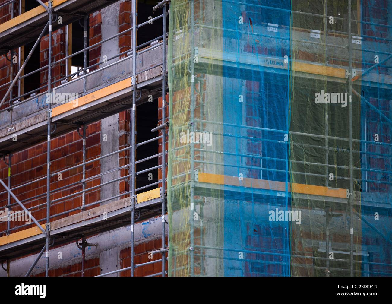 Close up of a supported scaffold attached to an unfinished building ...