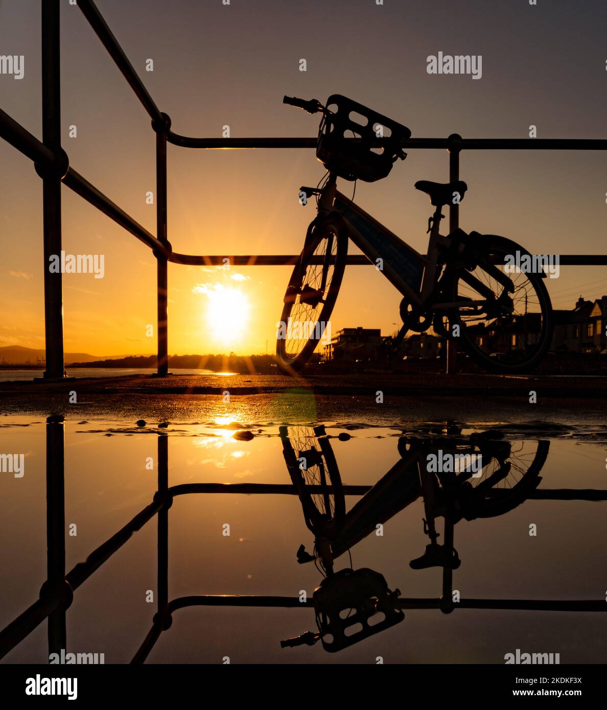 Bike sunset reflections at Kilbarrack Stock Photo - Alamy