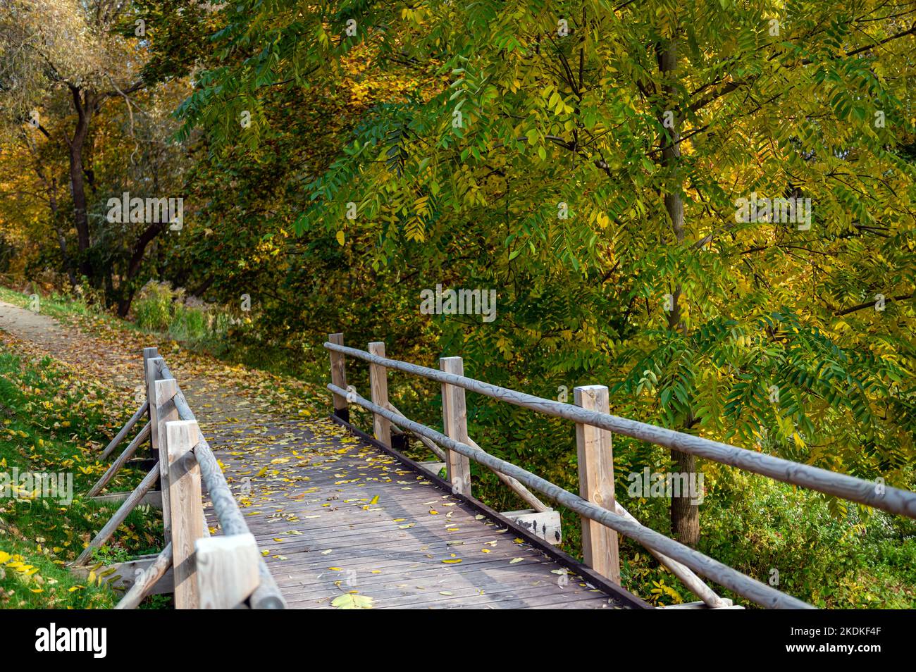 Wooden bridge for pedestrians next to a road in the countryside in ...