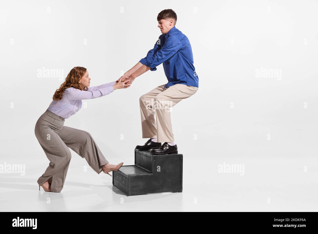 Portrait of man and woman, employees helping each other in professional ...