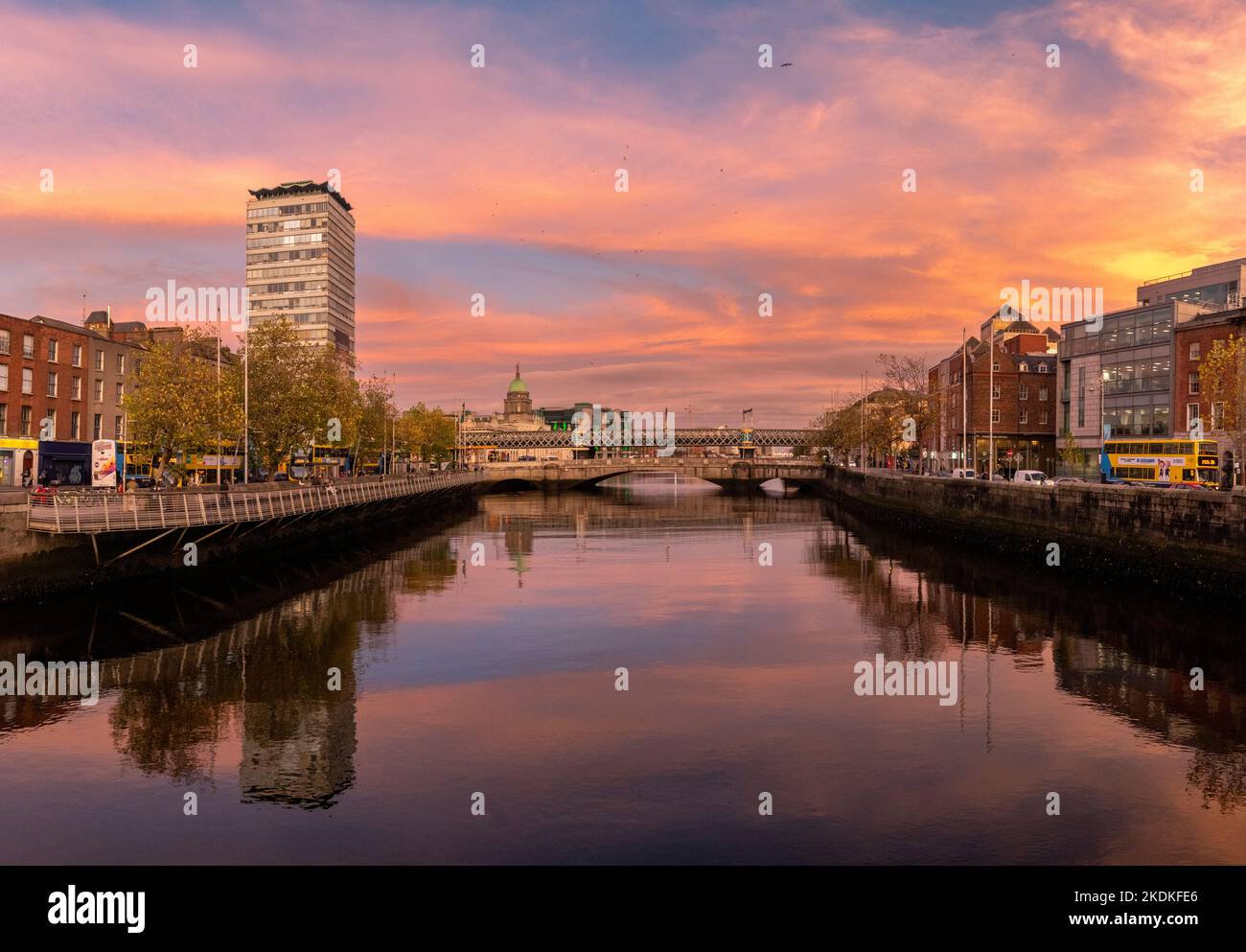 Pink sky reflections in Dublin City on a mild November evening Stock ...