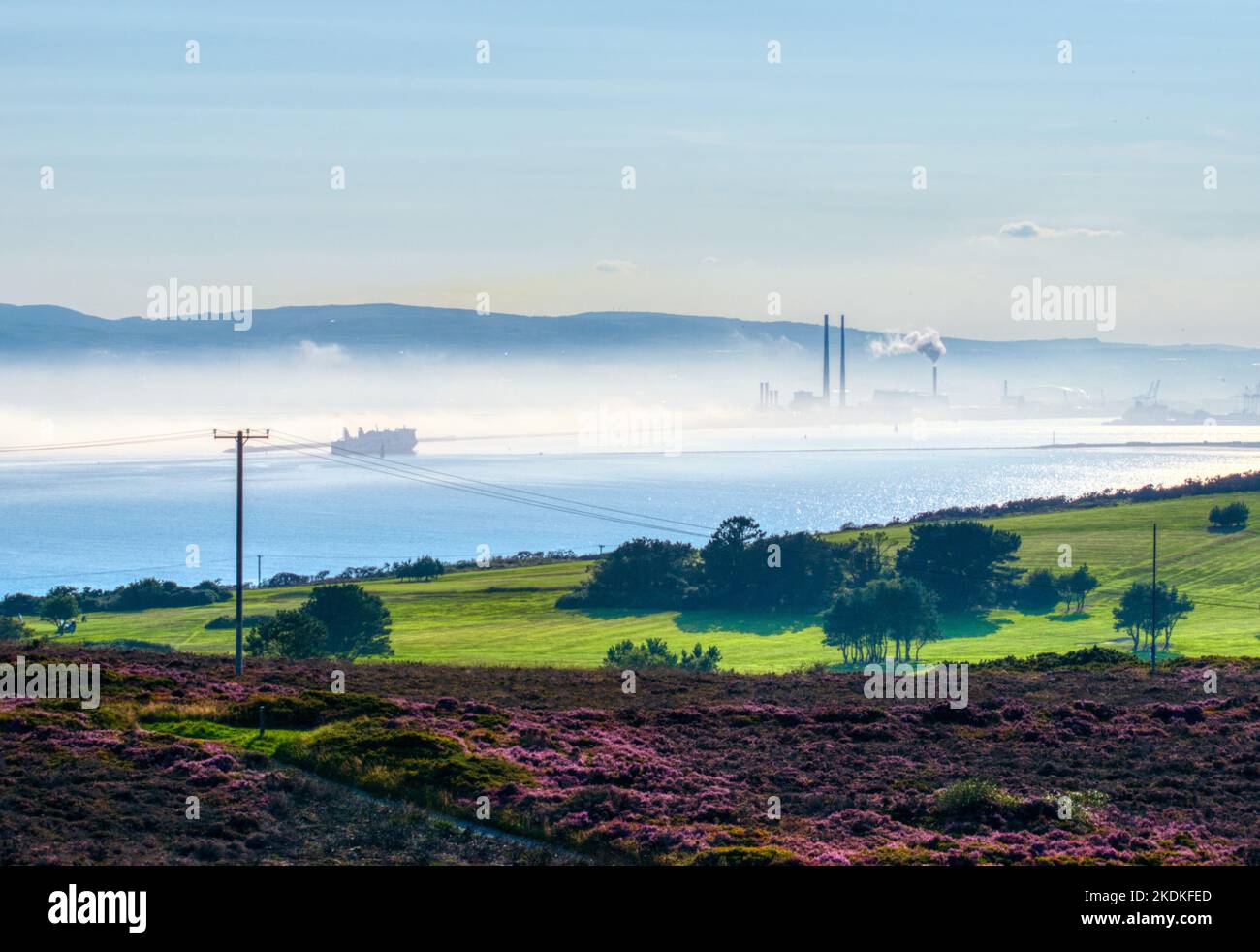 Coastal fog in the distance from the Ben of Howth on a fine August ...