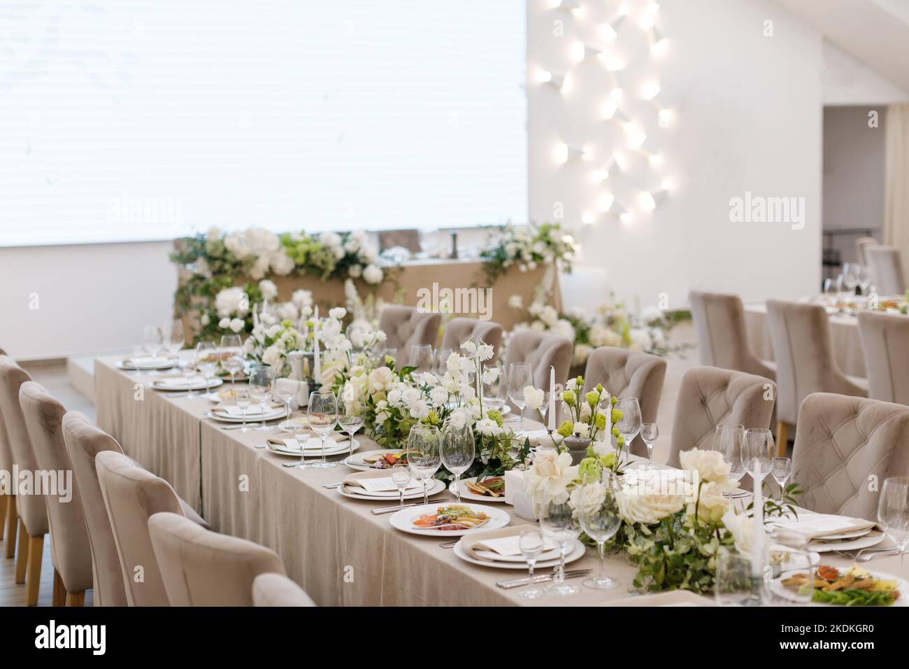 Tables setting at a luxury wedding. Table for guests. Dishes and drinks ...