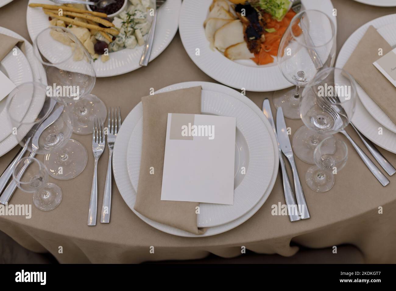 Tables setting at a luxury wedding. Table for guests. Dishes and drinks ...