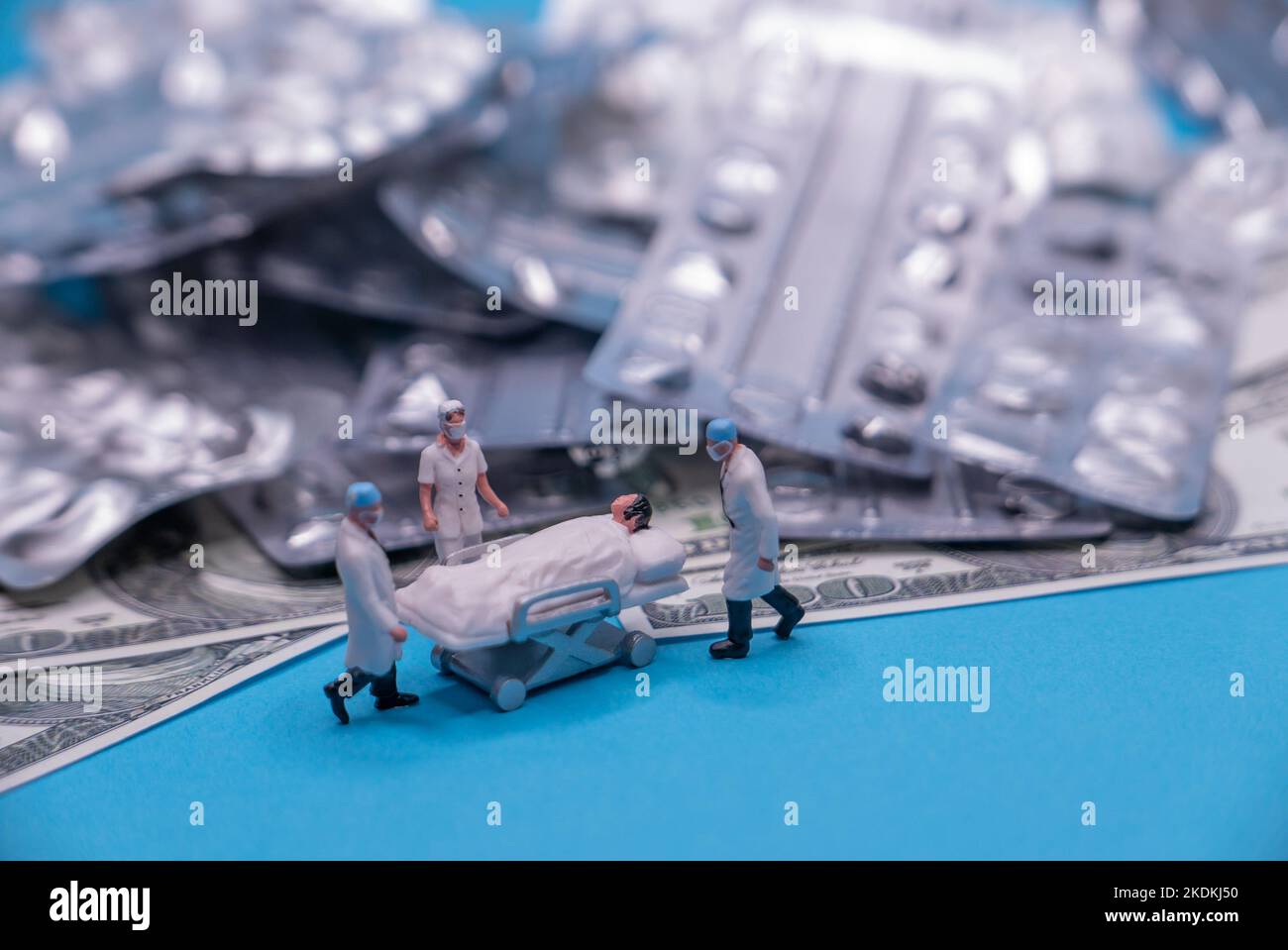 Miniature medical toy people - costly medical expenses concept Stock ...