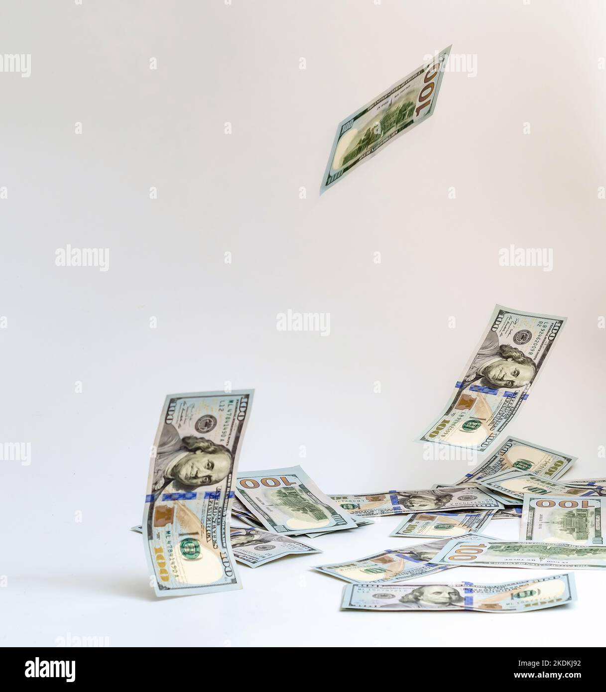 Hundred dollar bill falling on white background Stock Photo - Alamy