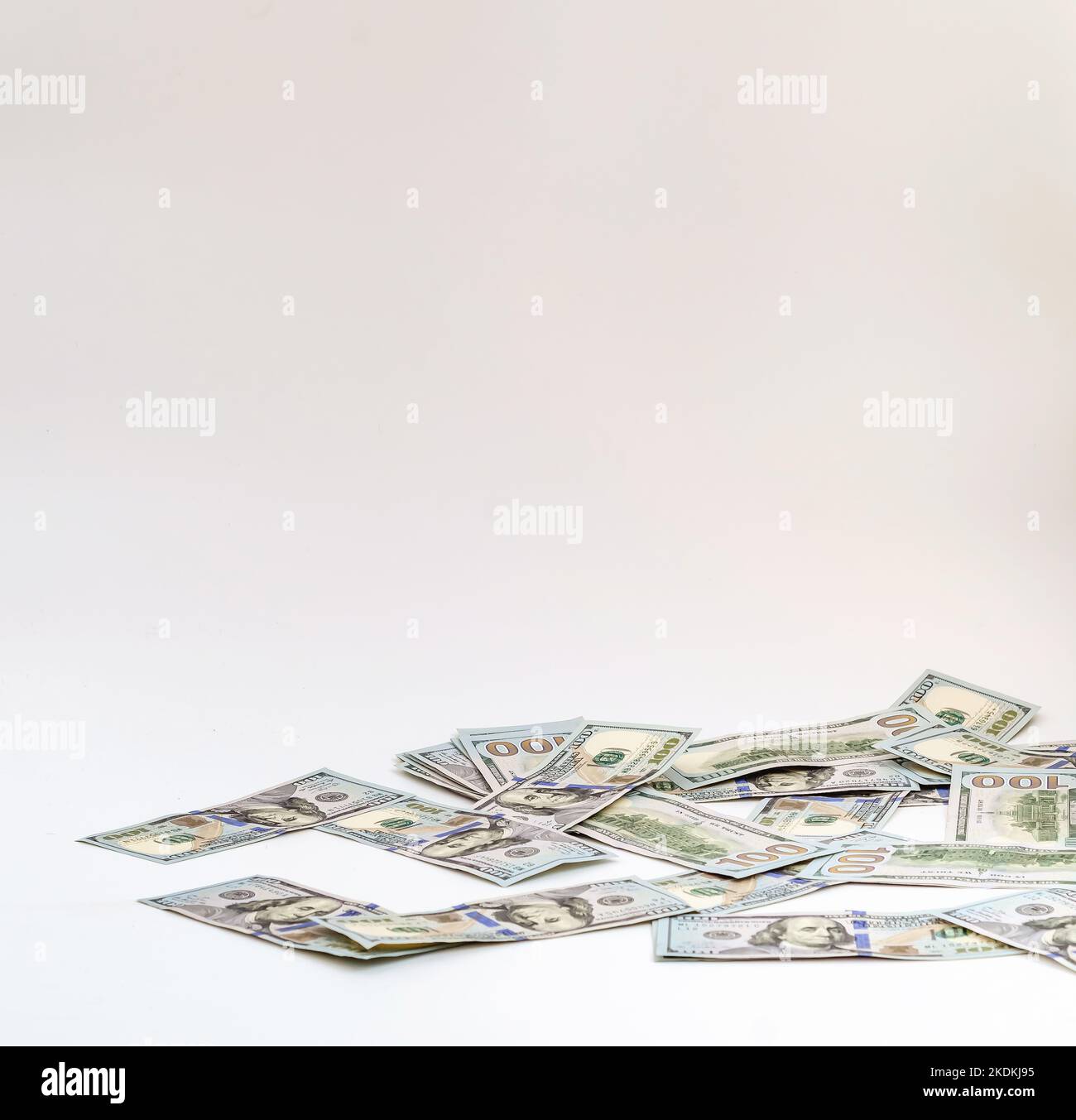 Falling paper money dollar bills on white background Stock Photo - Alamy