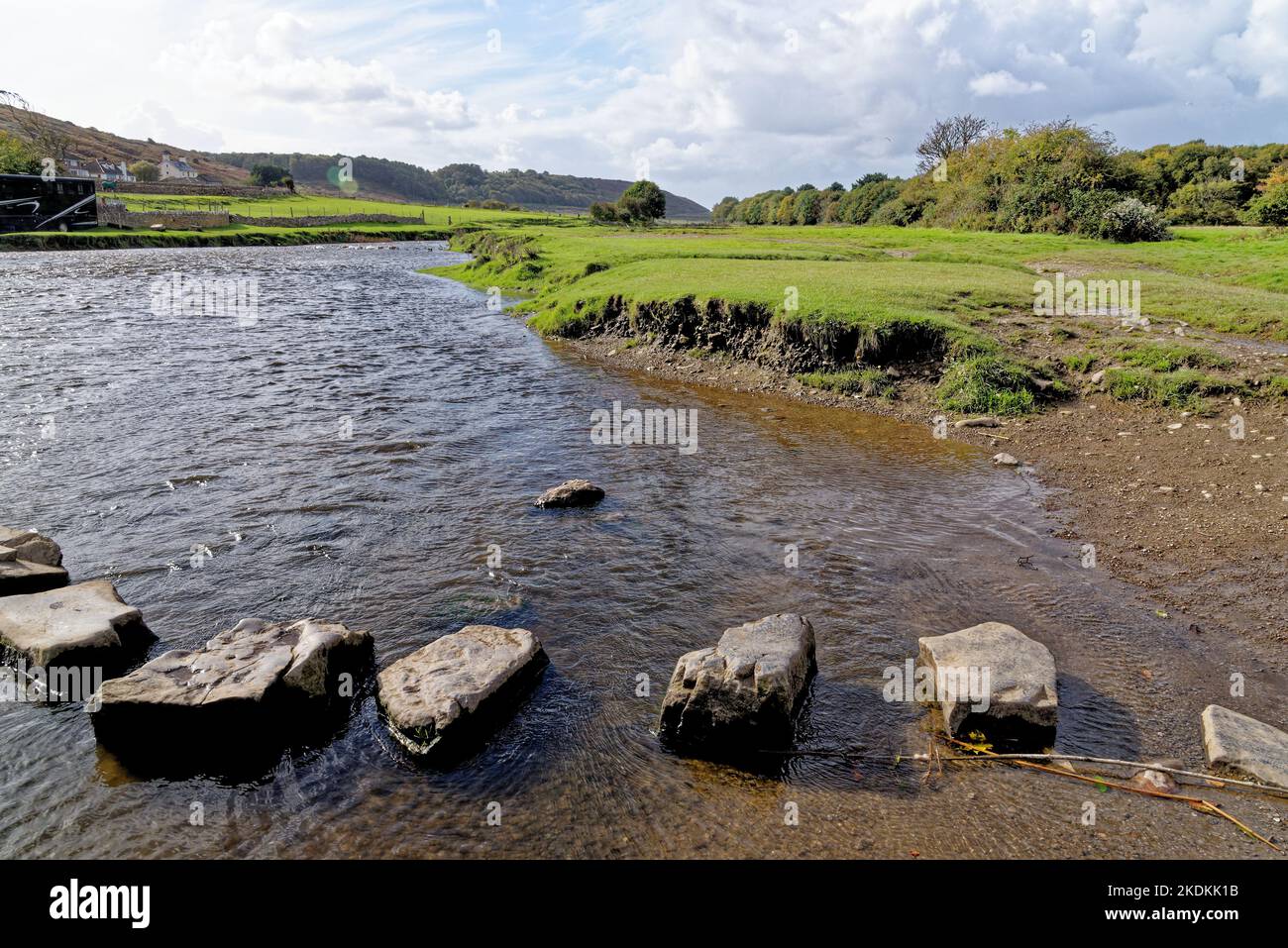 Old stepping stones to cross Ewenny River at Ogmore Castle. Ogmore by ...