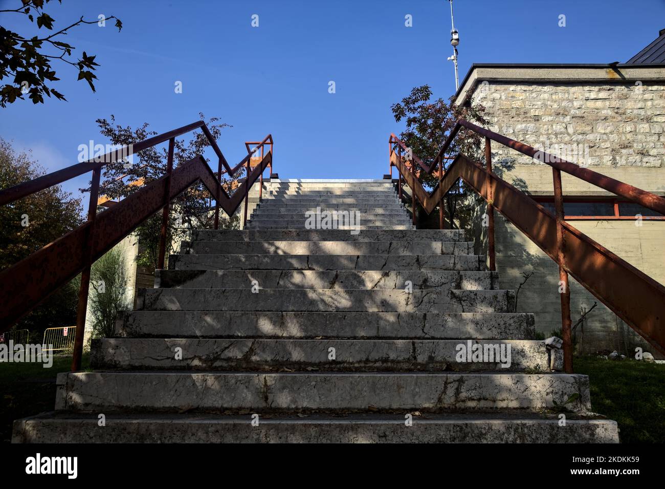 Staircase with red rails with the sky on the top of it Stock Photo - Alamy