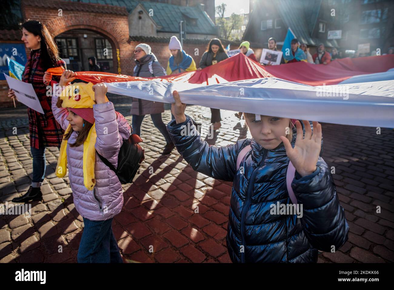 Kids seen holding a huge Polish flag during the march. The march of the ...
