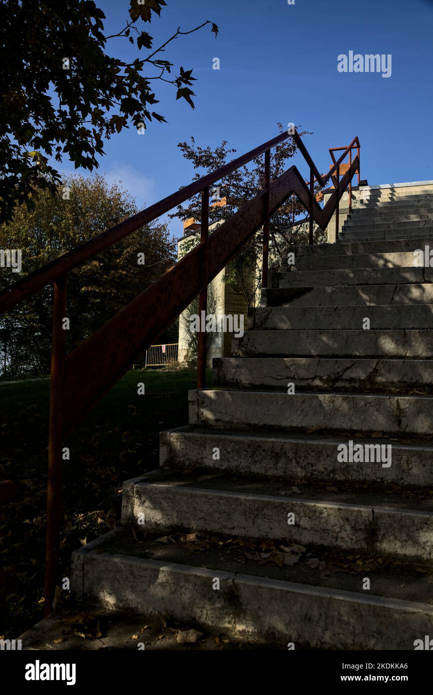 Staircase with red rails with the sky on the top of it Stock Photo - Alamy