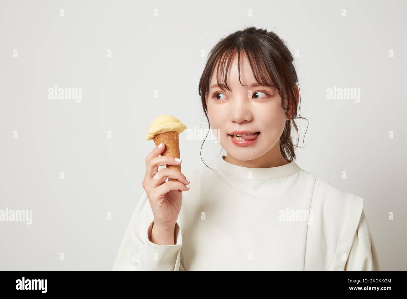 Happy woman eating ice cream hi-res stock photography and images - Alamy
