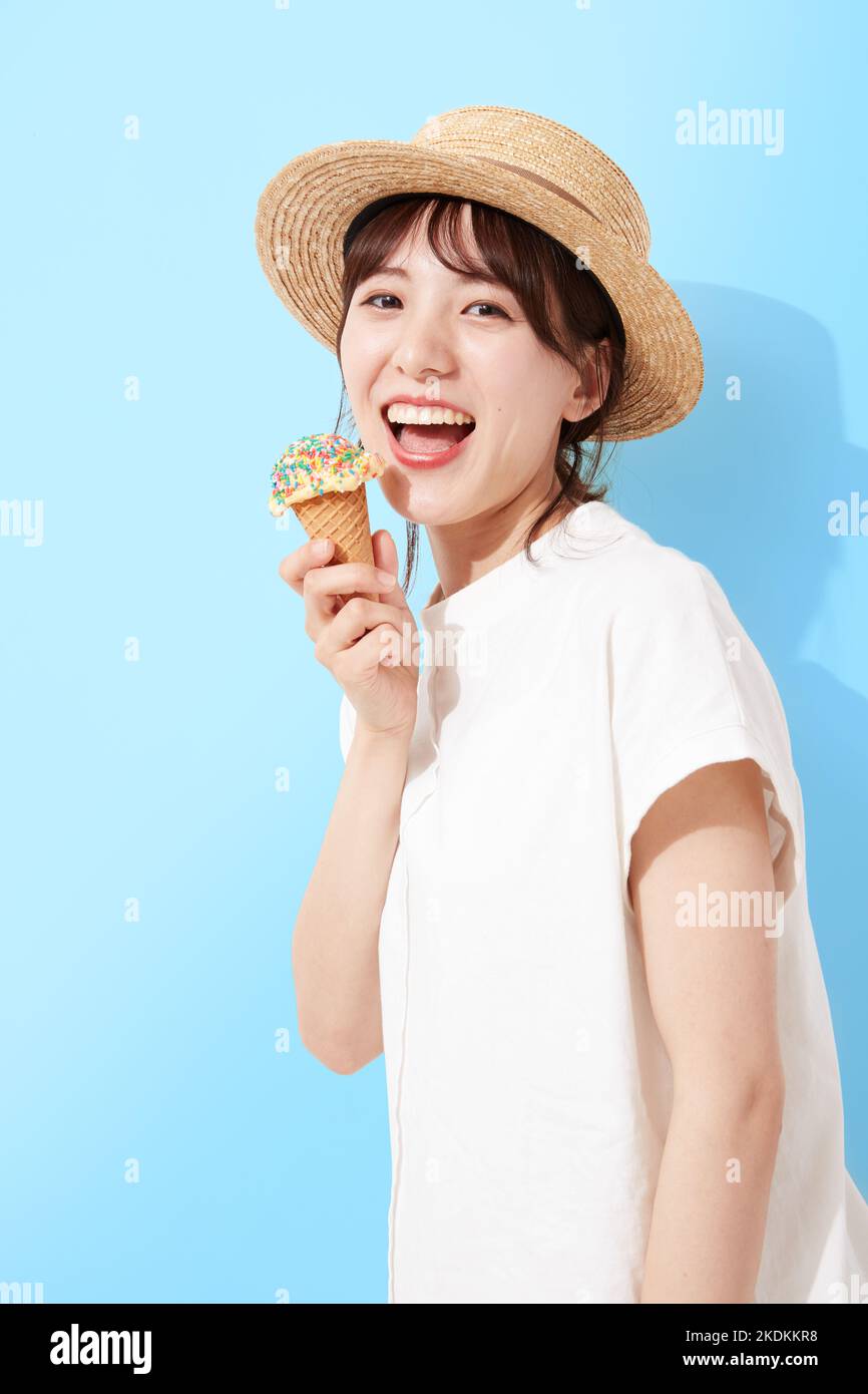 Young Japanese woman eating ice cream Stock Photo - Alamy