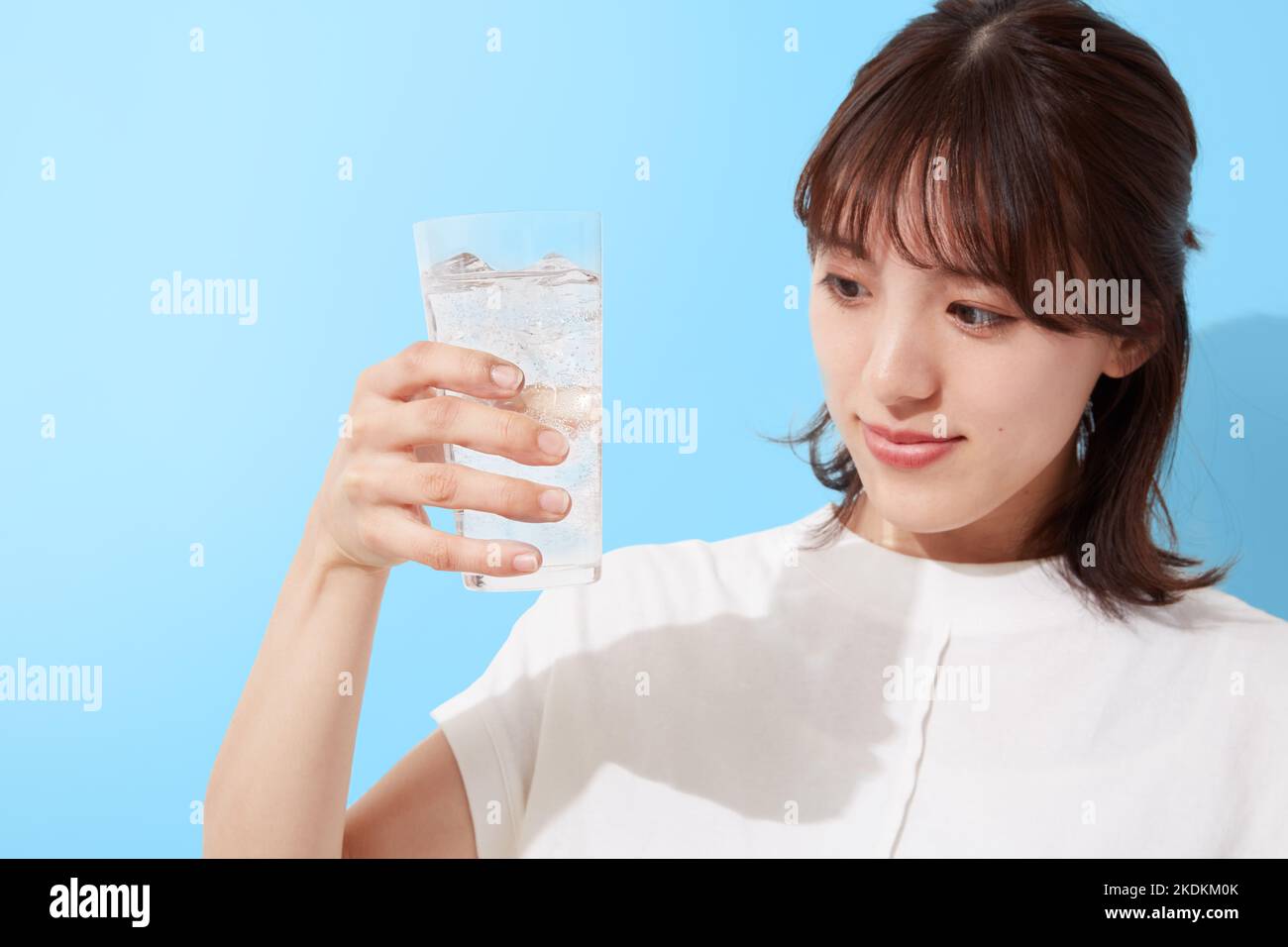 Young Japanese woman drinking water Stock Photo - Alamy