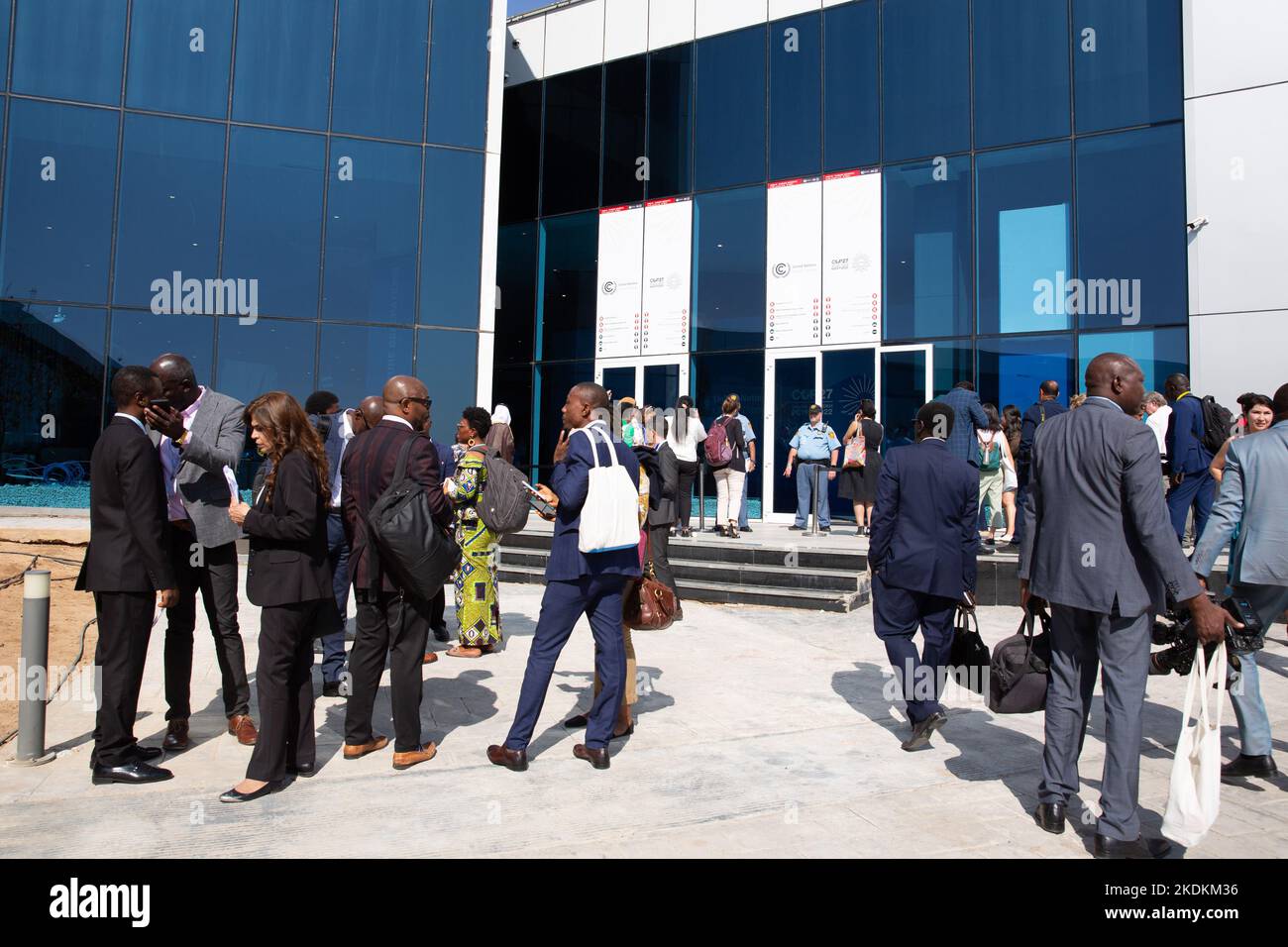 Participants wait to enter the plenary hall where the high level ...