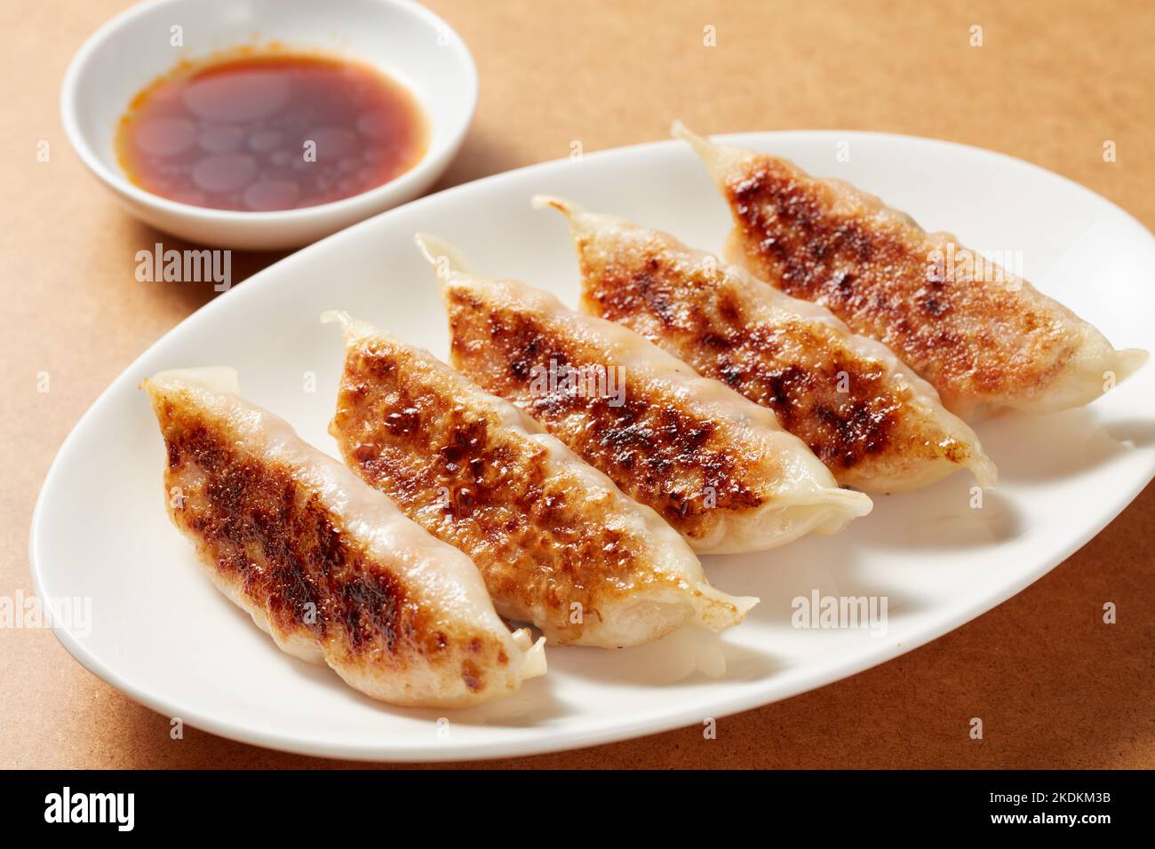 Plate fried chinese dumplings hi-res stock photography and images - Alamy