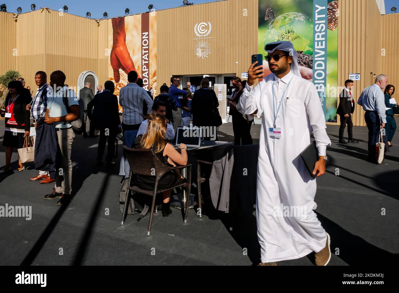 Participants walk in the Delegation Pavilion area on the second day of ...