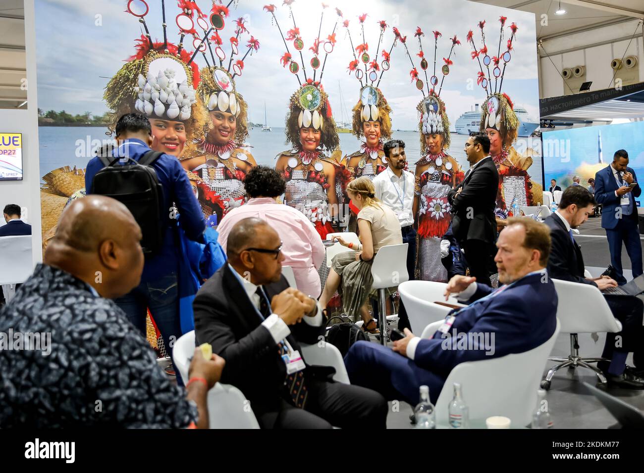 Participants rest in the Delegation Pavilion on the second day of the ...