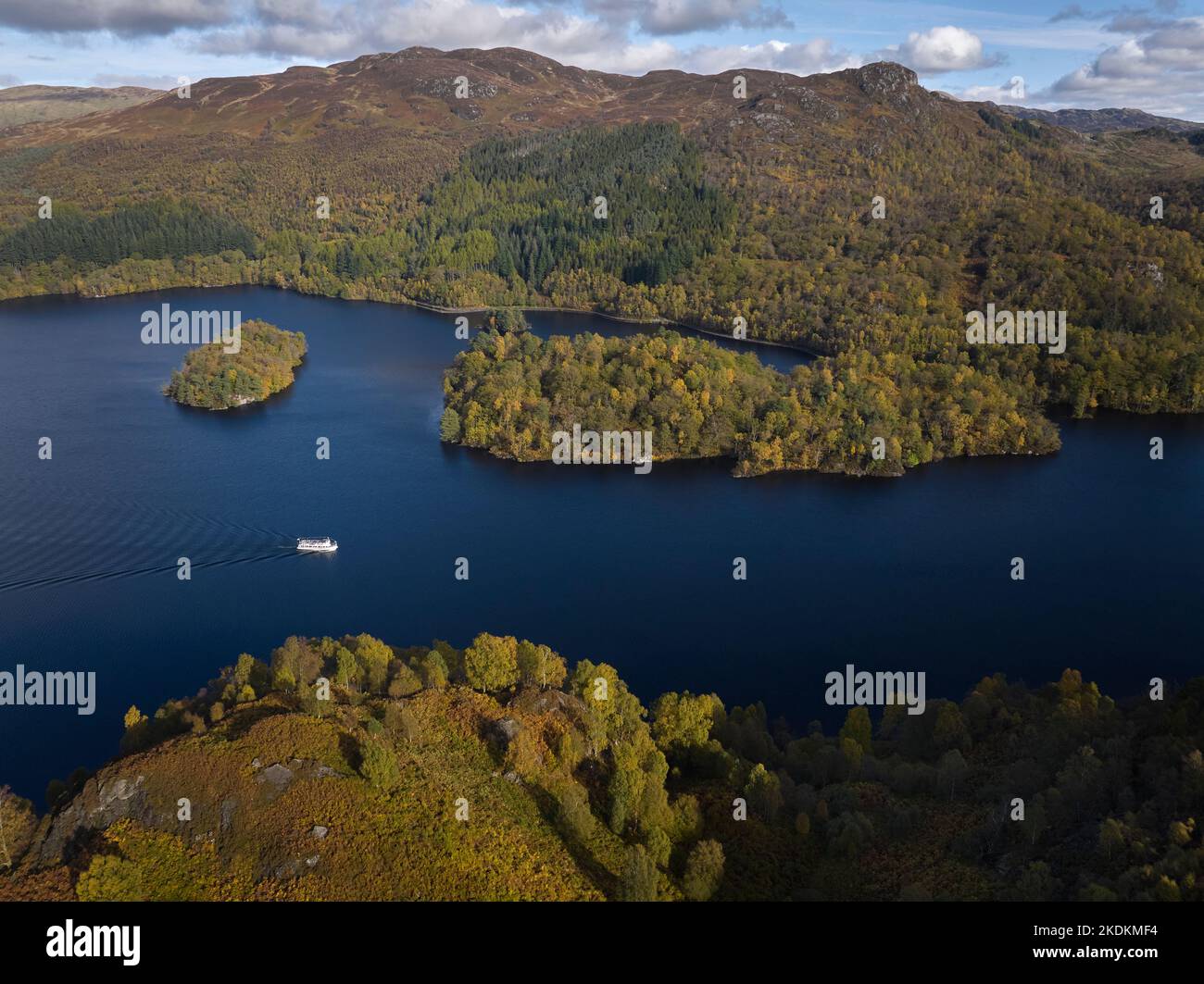 Aerial view of a boat cruise on Loch Katrine in the Trossachs as it ...