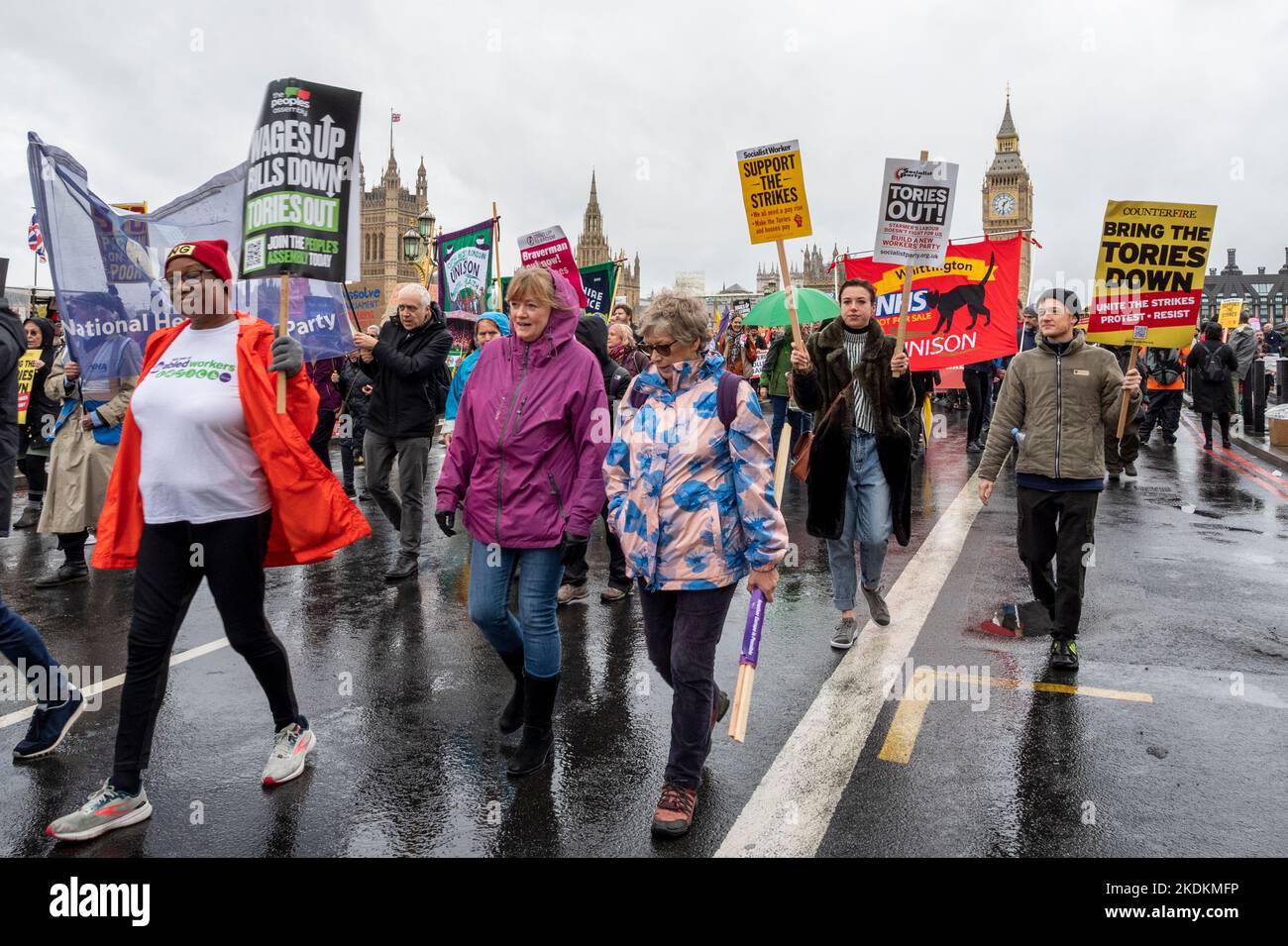 Protestors against the Conservative Government with various posters ...