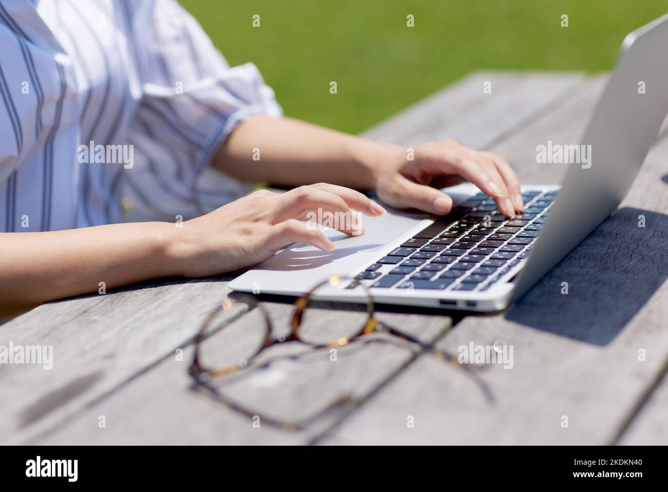 Young Japanese woman working outside Stock Photo - Alamy