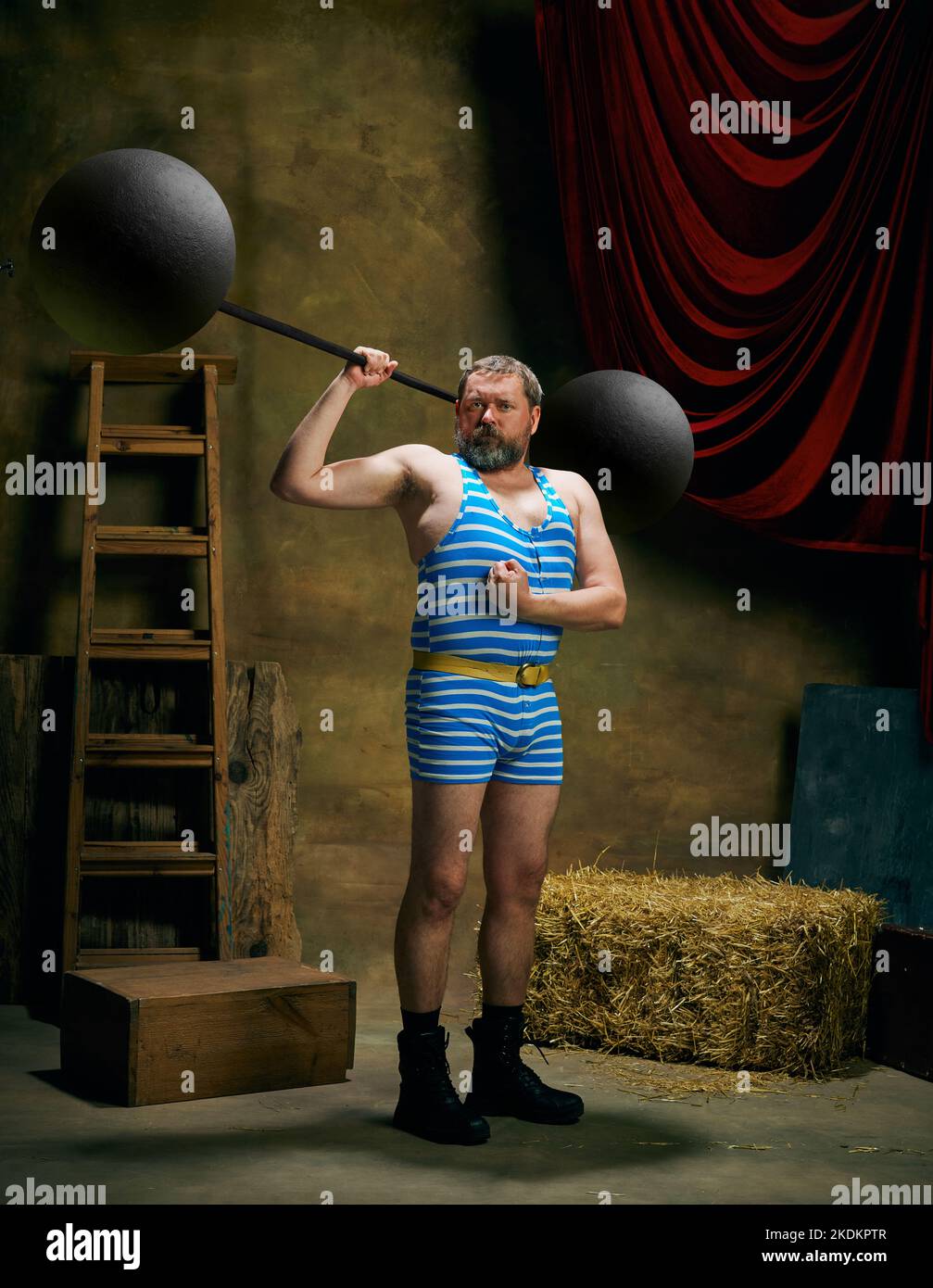 Retro circus. Cinematic portrait of retro circus strongman wearing ...
