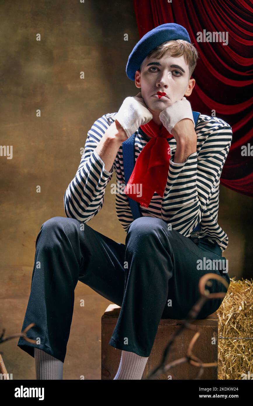 Vintage portrait of male mime artist expressing sadness and loneliness ...
