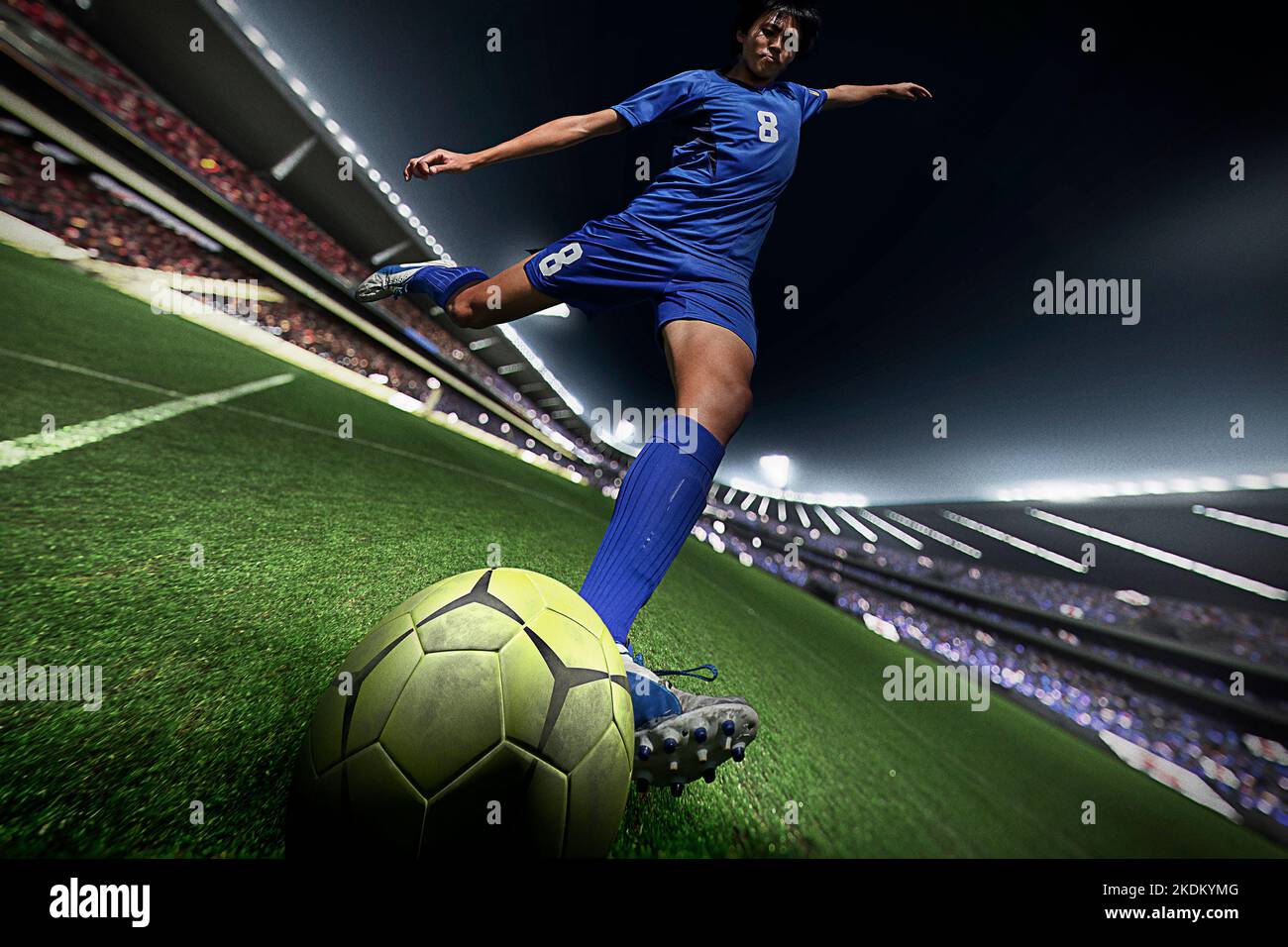 Soccer player hitting the ball Stock Photo - Alamy