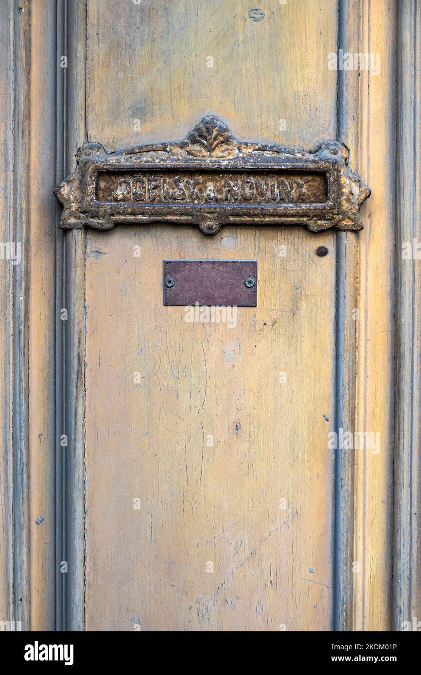 Old weathered wooden door with antique decorated rusty mailbox for ...