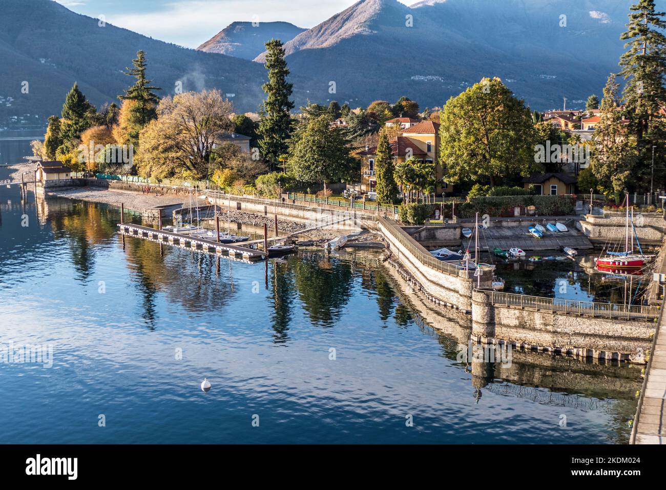 Aerial view of Maccagno with plants that are reflecting in the Lake ...