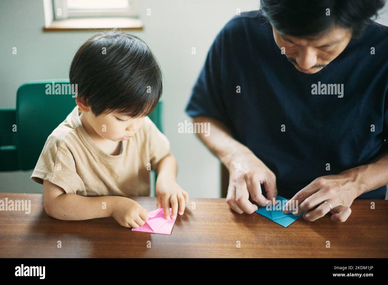 Japanese kid playing with his dad at home Stock Photo - Alamy