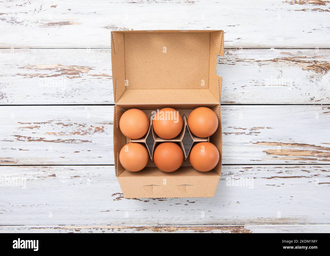Brown bio organic eggs in paper tray on white wooden background.Top ...