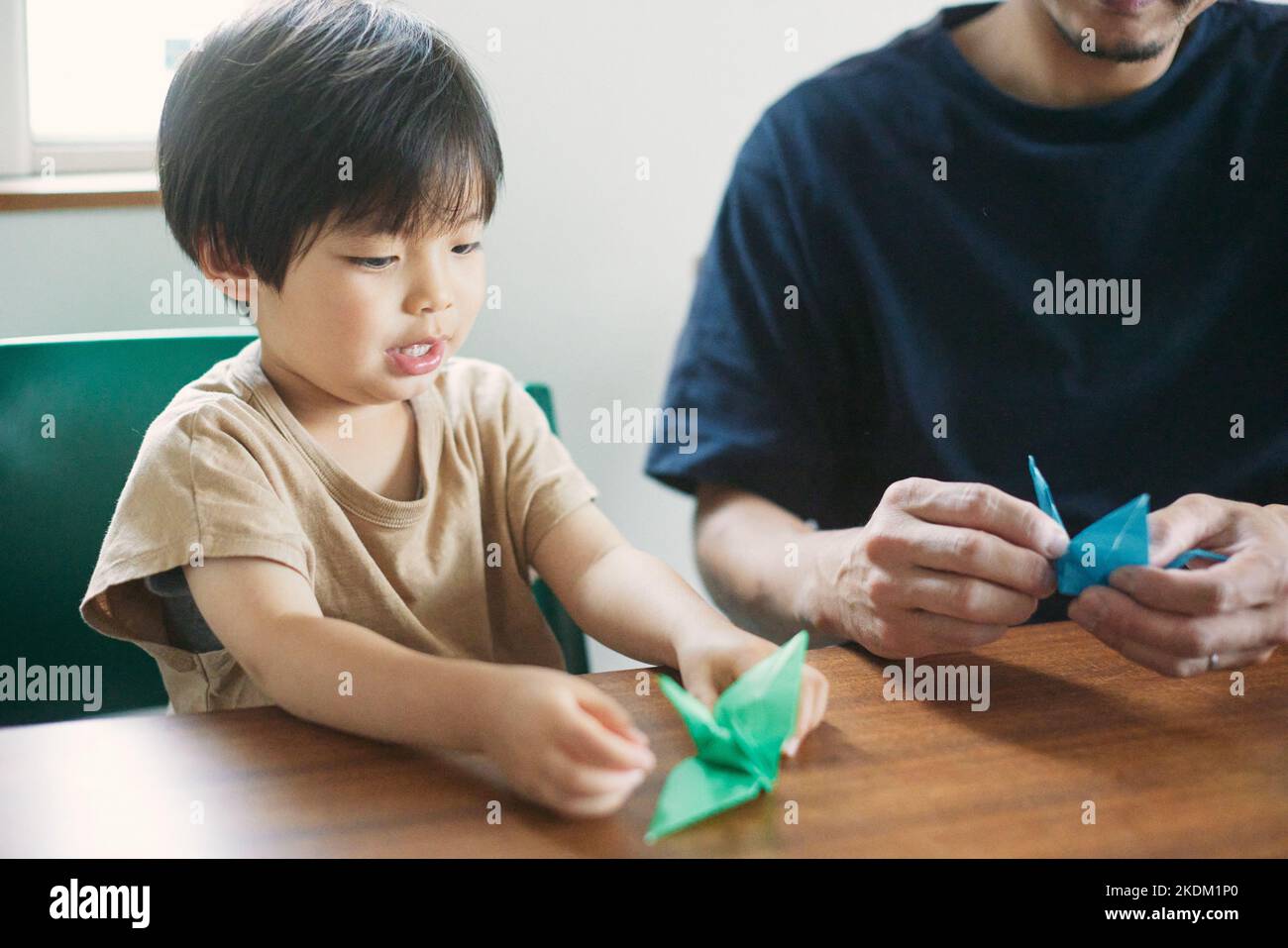 Japanese kid playing with his dad at home Stock Photo - Alamy