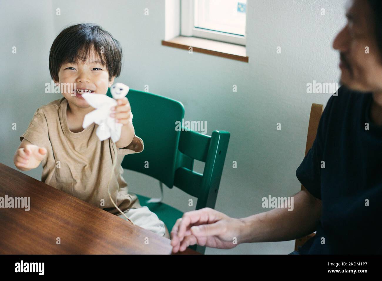 Japanese kid playing with his dad at home Stock Photo - Alamy