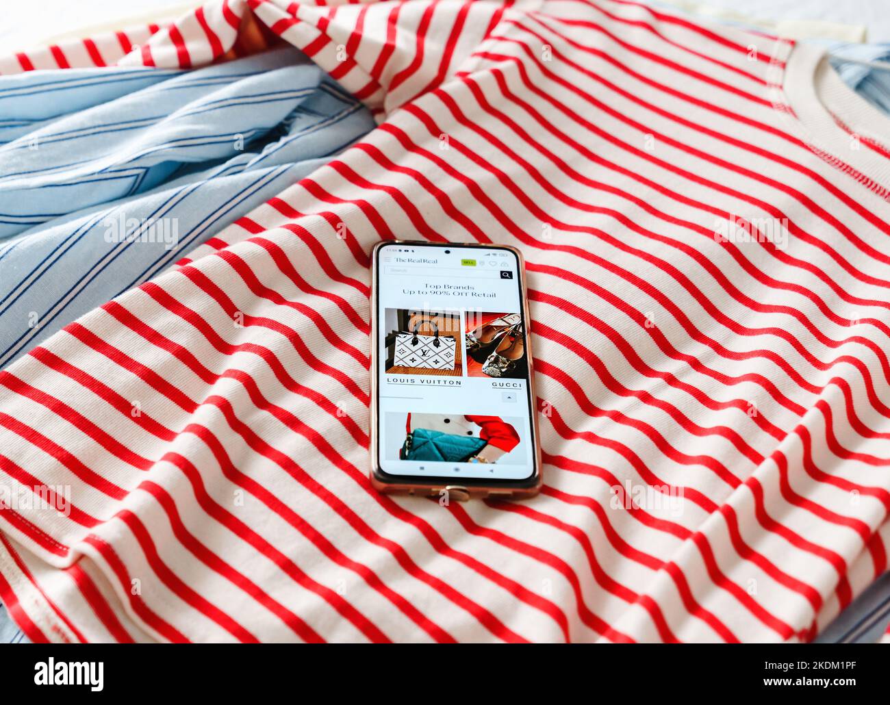 Smartphone with open site TheRealReal Stock Photo - Alamy